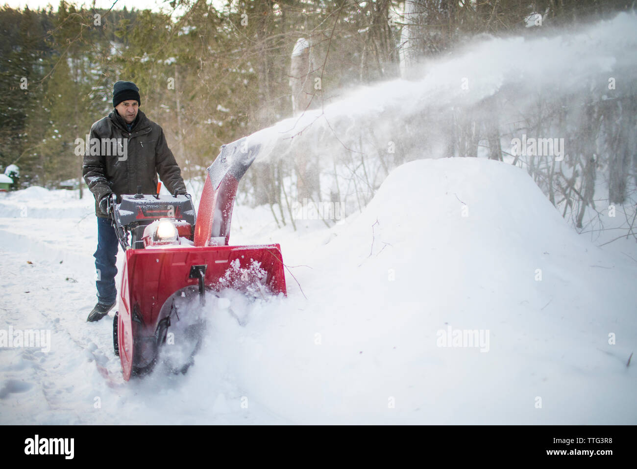 Man using snow blower clear hi-res stock photography and images - Alamy