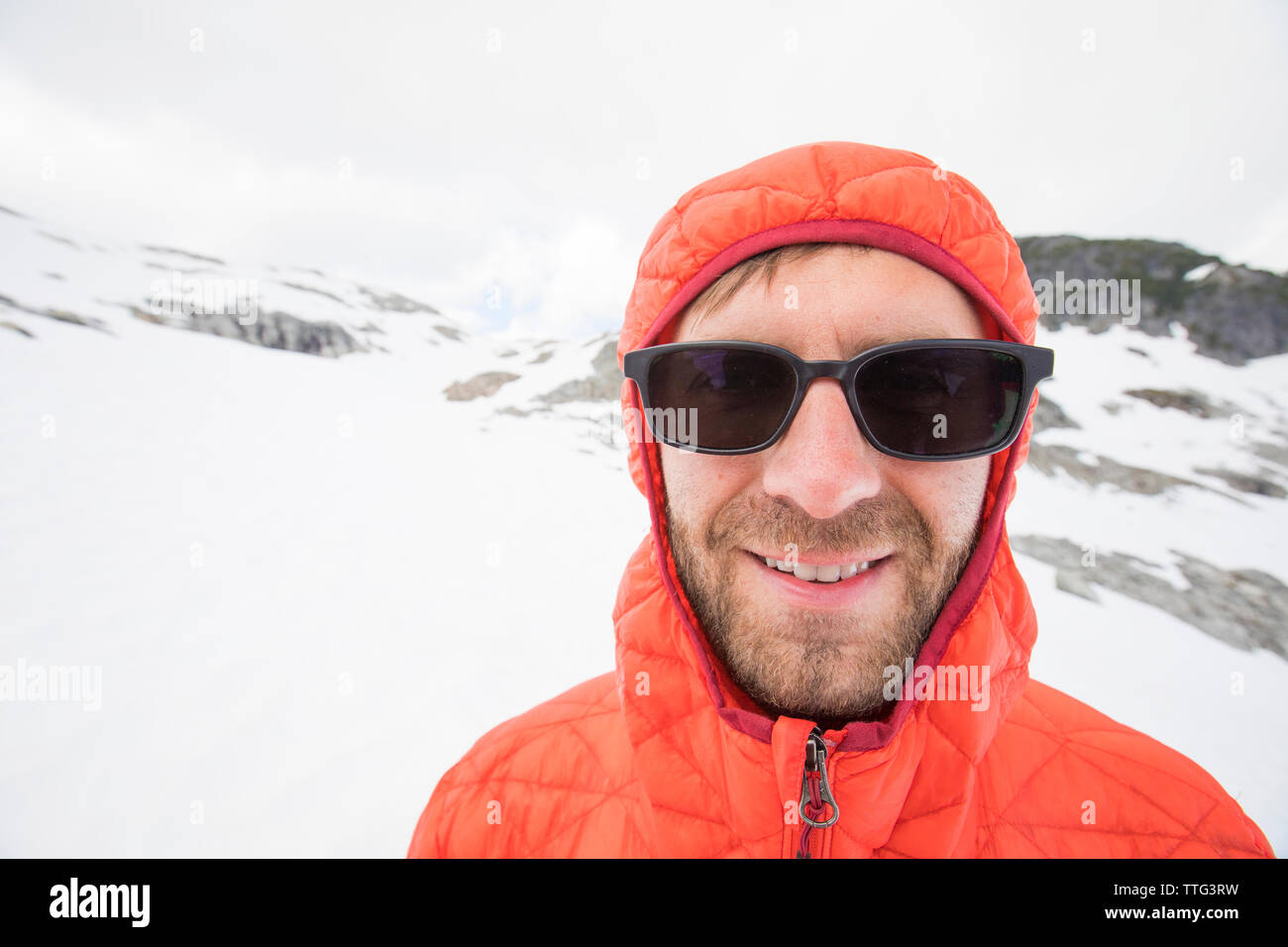 Portrait of Caucasian mountaineer wearing glasses Stock Photo - Alamy