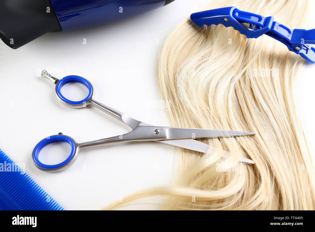 Barber set with strand of hair, tools and equipment, isolated on white ...