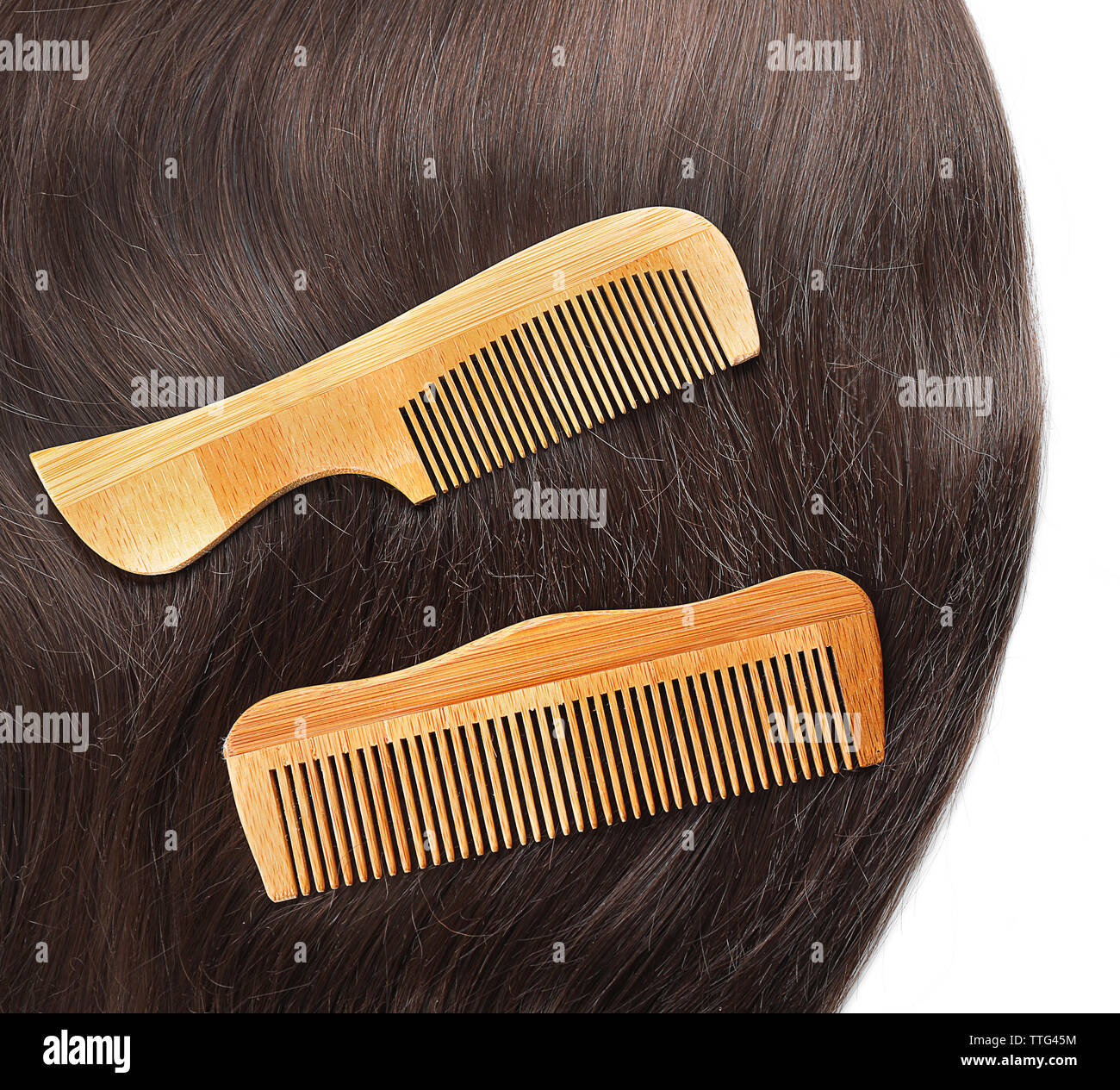 Barber set with strand of hair and wooden combs, isolated on white ...