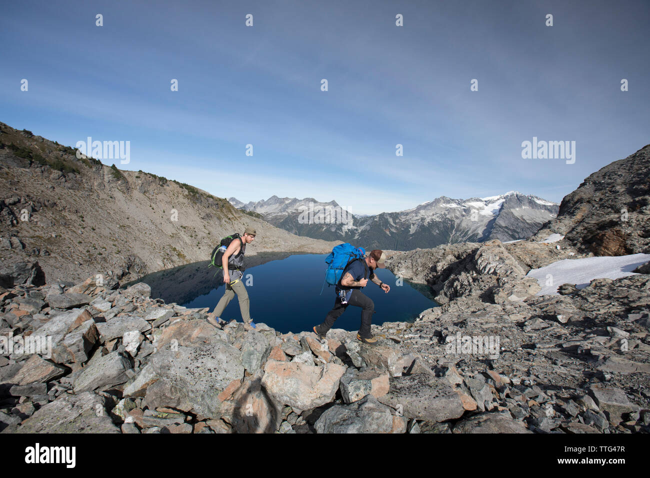 Two backpacker hiking over rugged terrain, B.C., Canada Stock Photo - Alamy