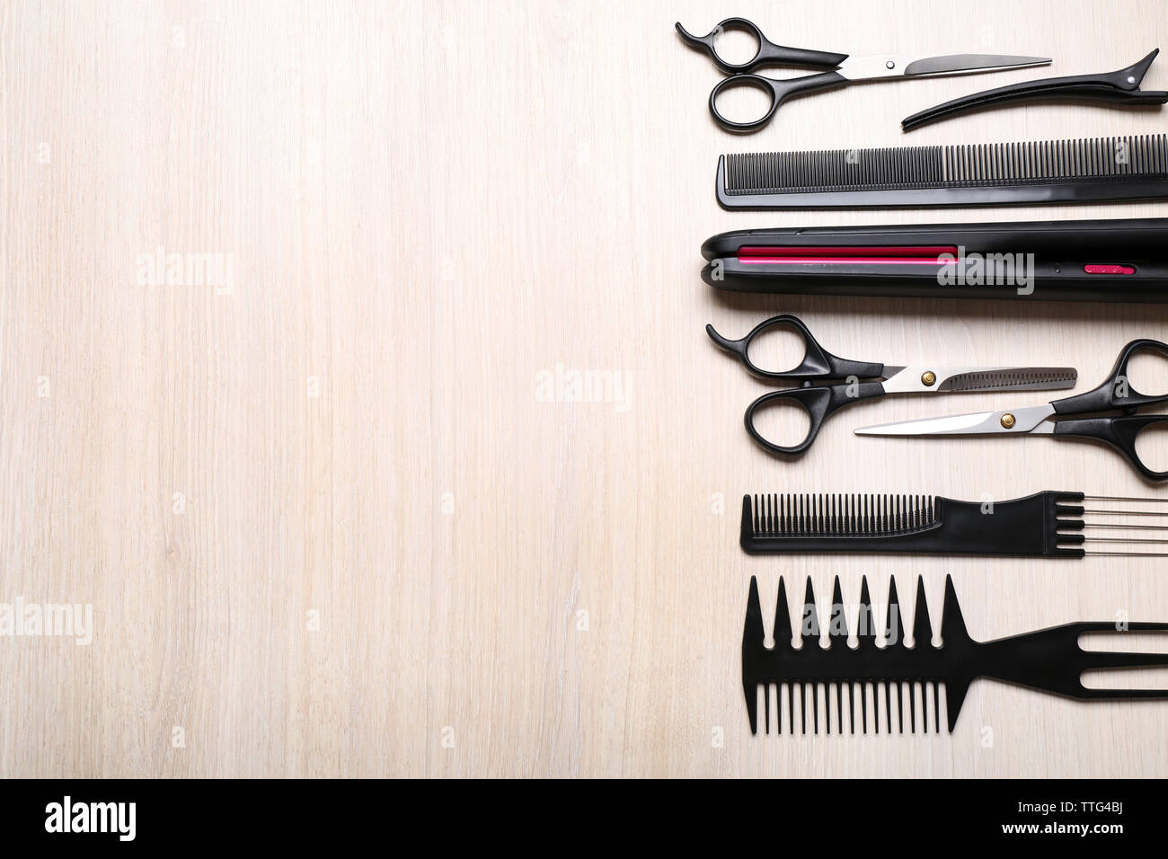 Barber set with tools and equipment on light wooden table Stock Photo ...