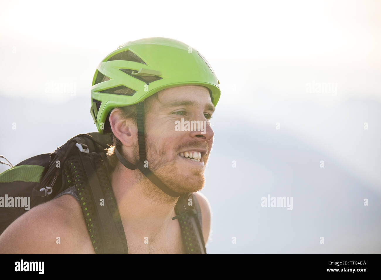 Portrait of a happy climber wearing helmet Stock Photo - Alamy