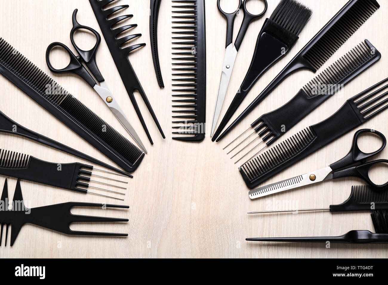 Barber set with tools on light wooden table Stock Photo - Alamy
