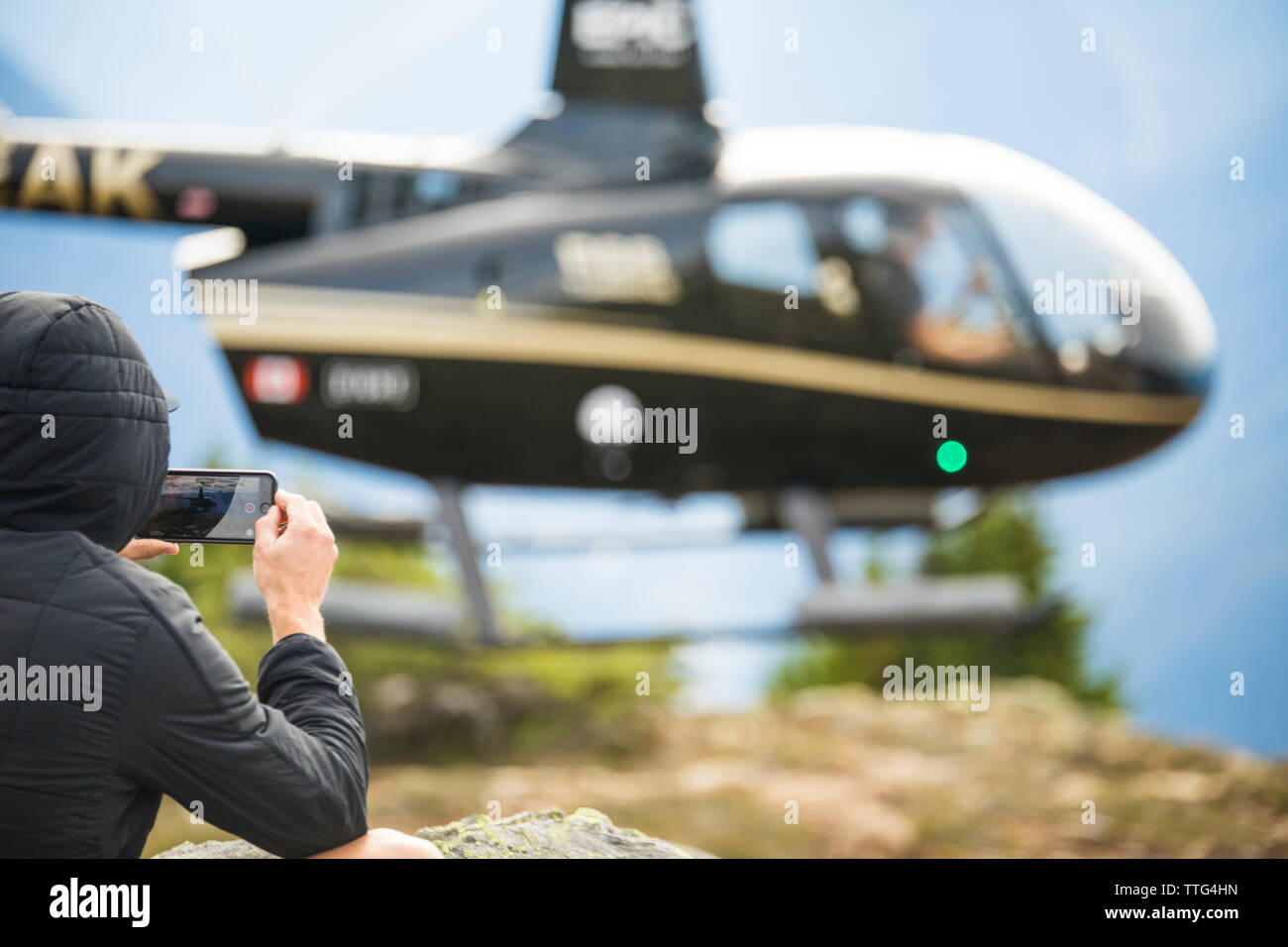 Man captures video of a helicopter taking off Stock Photo - Alamy