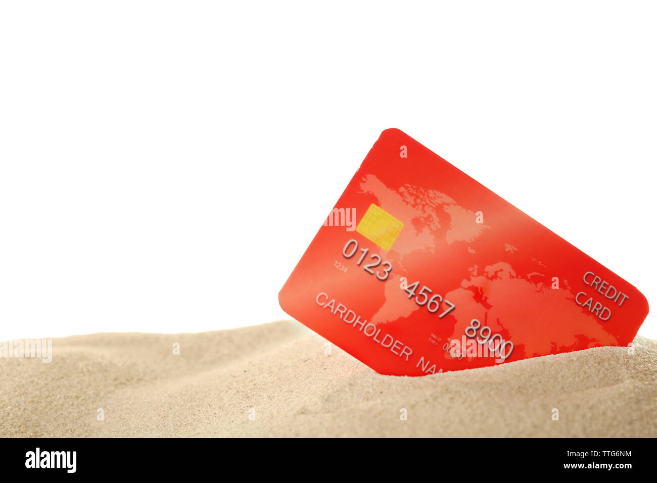 Red bank card in sand isolated on white Stock Photo - Alamy