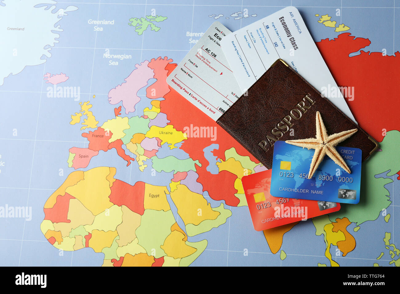Credit cards with passports and tickets for vacations on the world map ...
