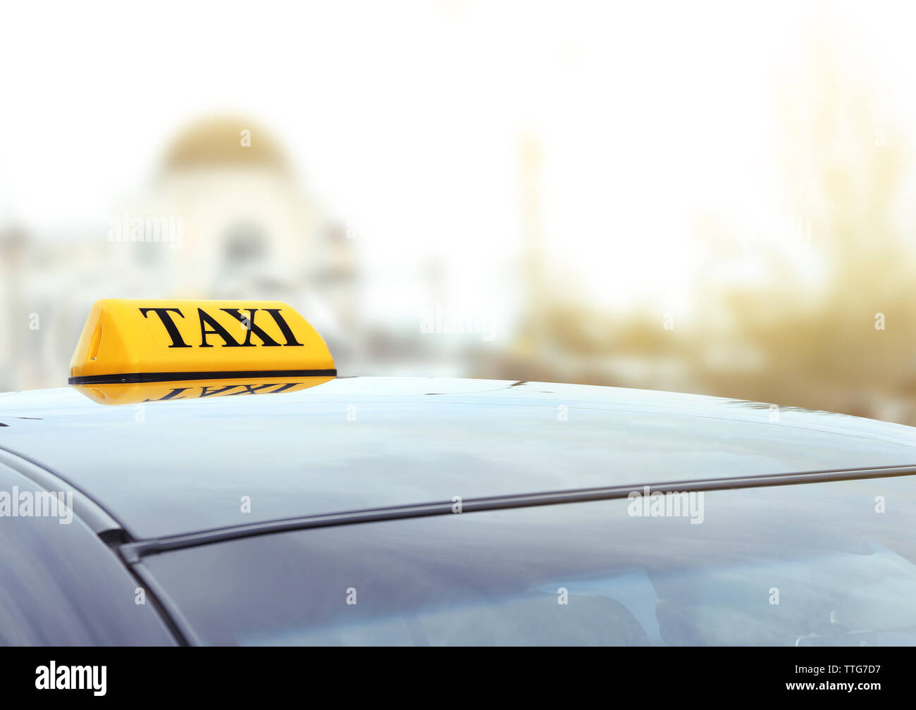 Taxi sign on car, outdoor Stock Photo - Alamy