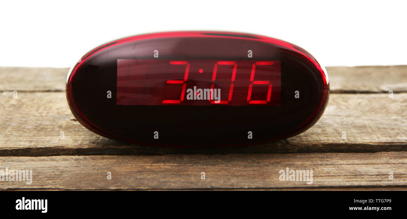 Digital clock on wooden table Stock Photo - Alamy