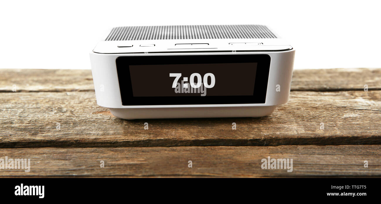 Digital clock on wooden table Stock Photo - Alamy