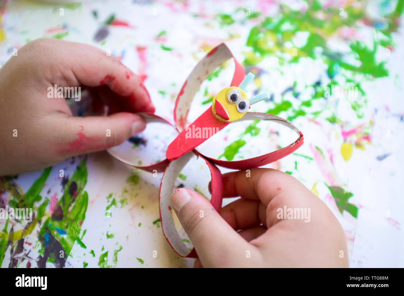 Child making a butterfly with recycled materials and EVA foam Stock ...