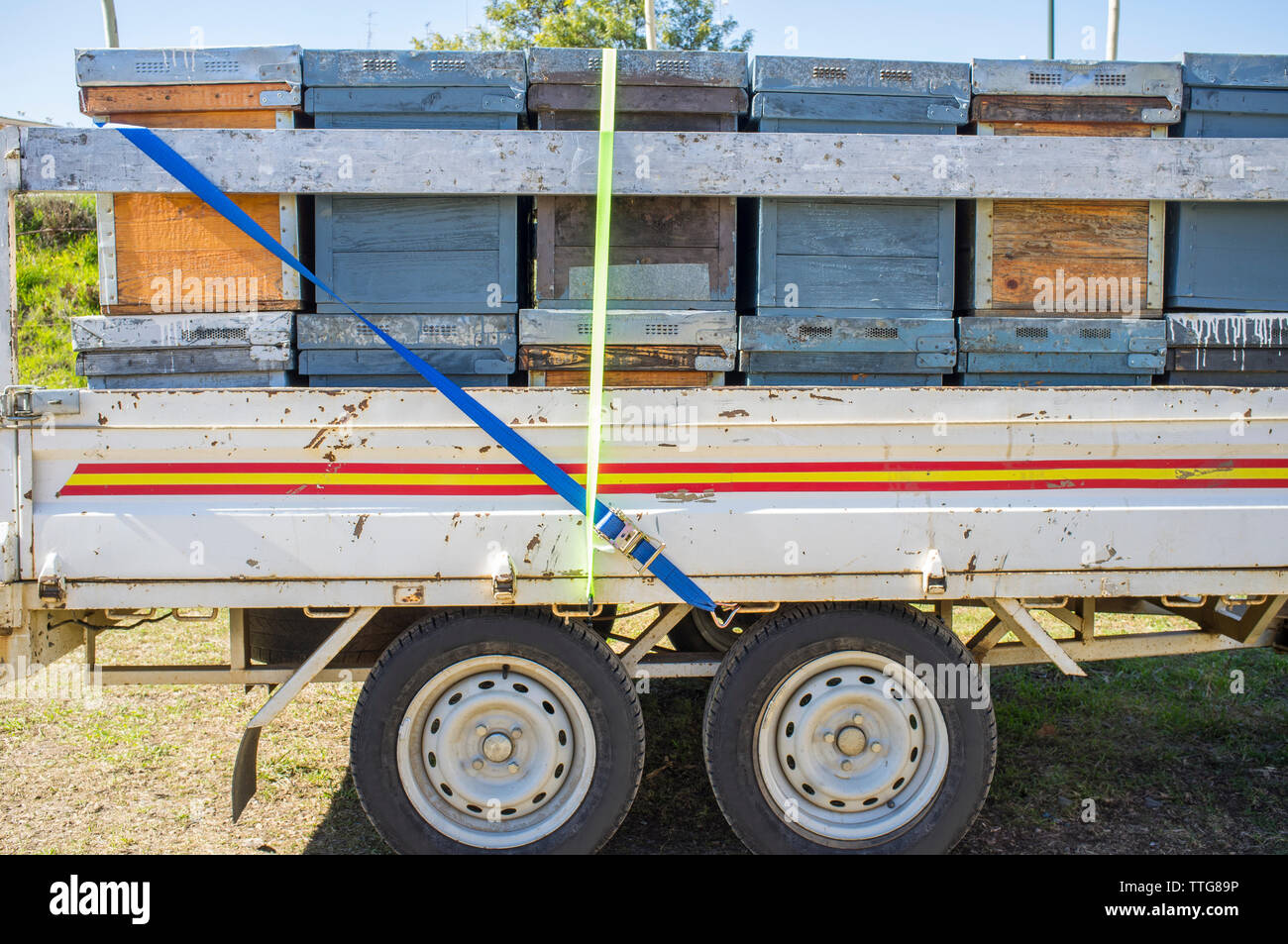 Trailer load with wooden beehives ready to move Stock Photo - Alamy