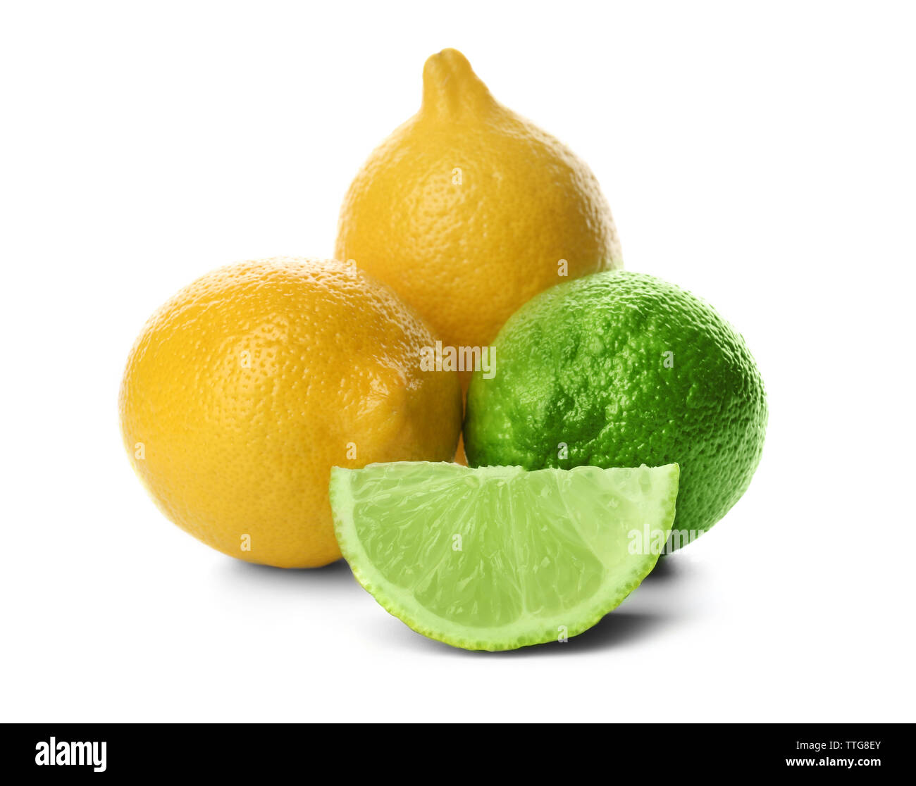 Fresh lime and lemons with slice isolated on white Stock Photo - Alamy