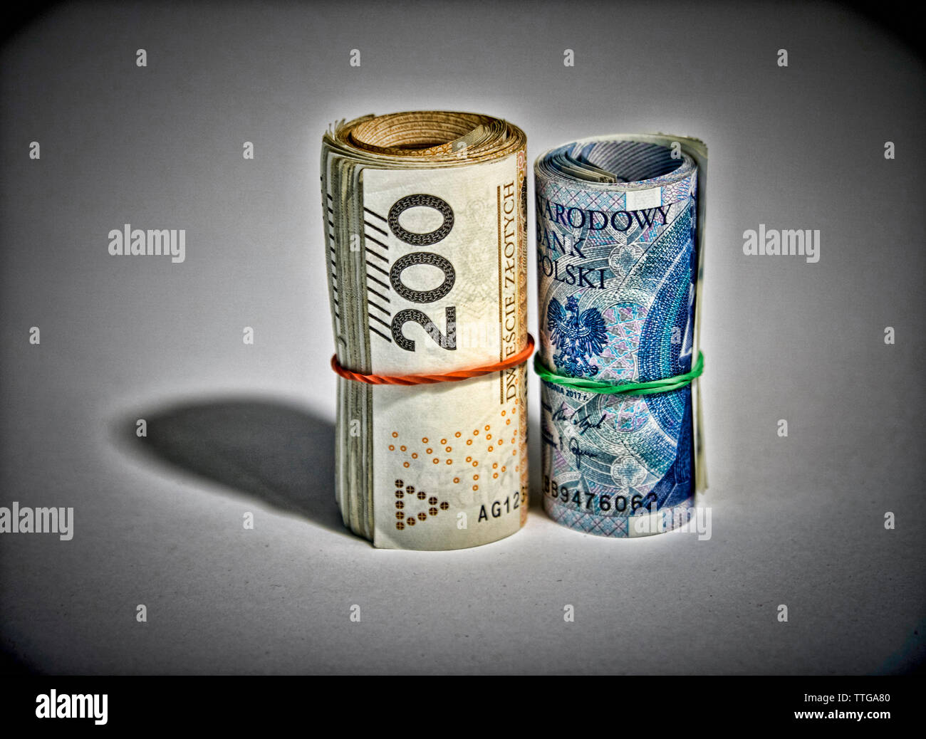 Rolled up polish money (PLN) - two hundred and fifty polish zloty bills ...