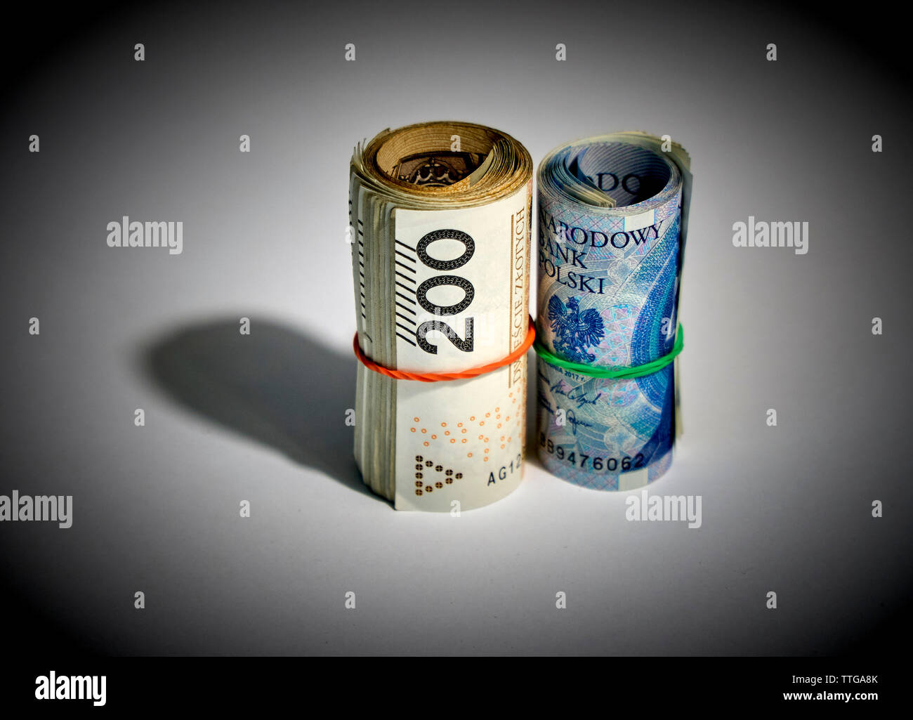Rolled up polish money (PLN) - two hundred and fifty polish zloty bills ...