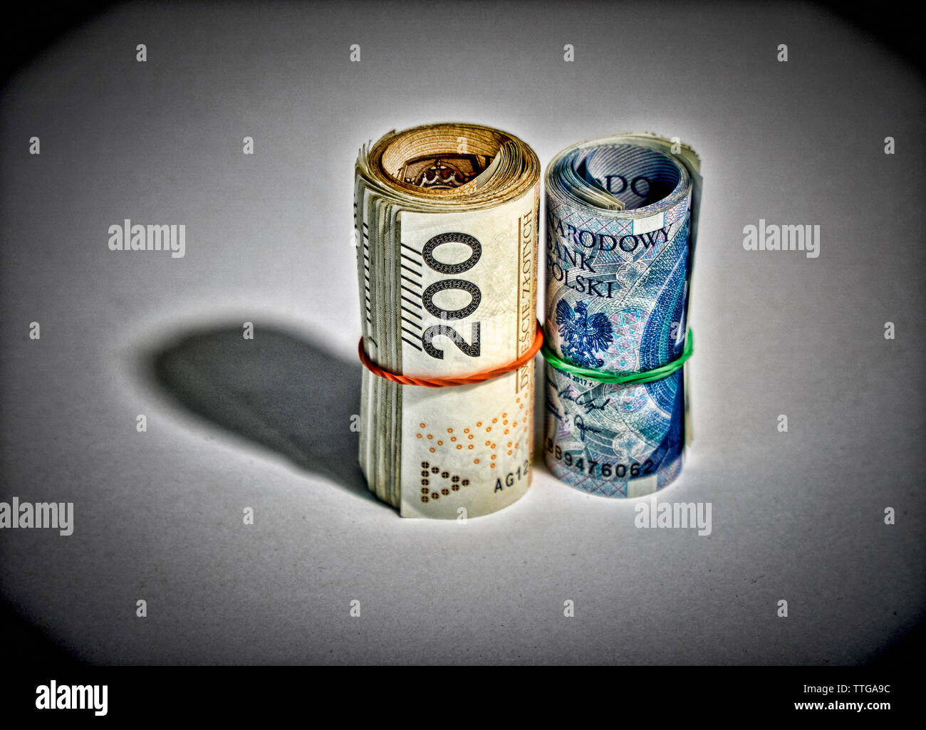Rolled up polish money (PLN) - two hundred and fifty polish zloty bills ...
