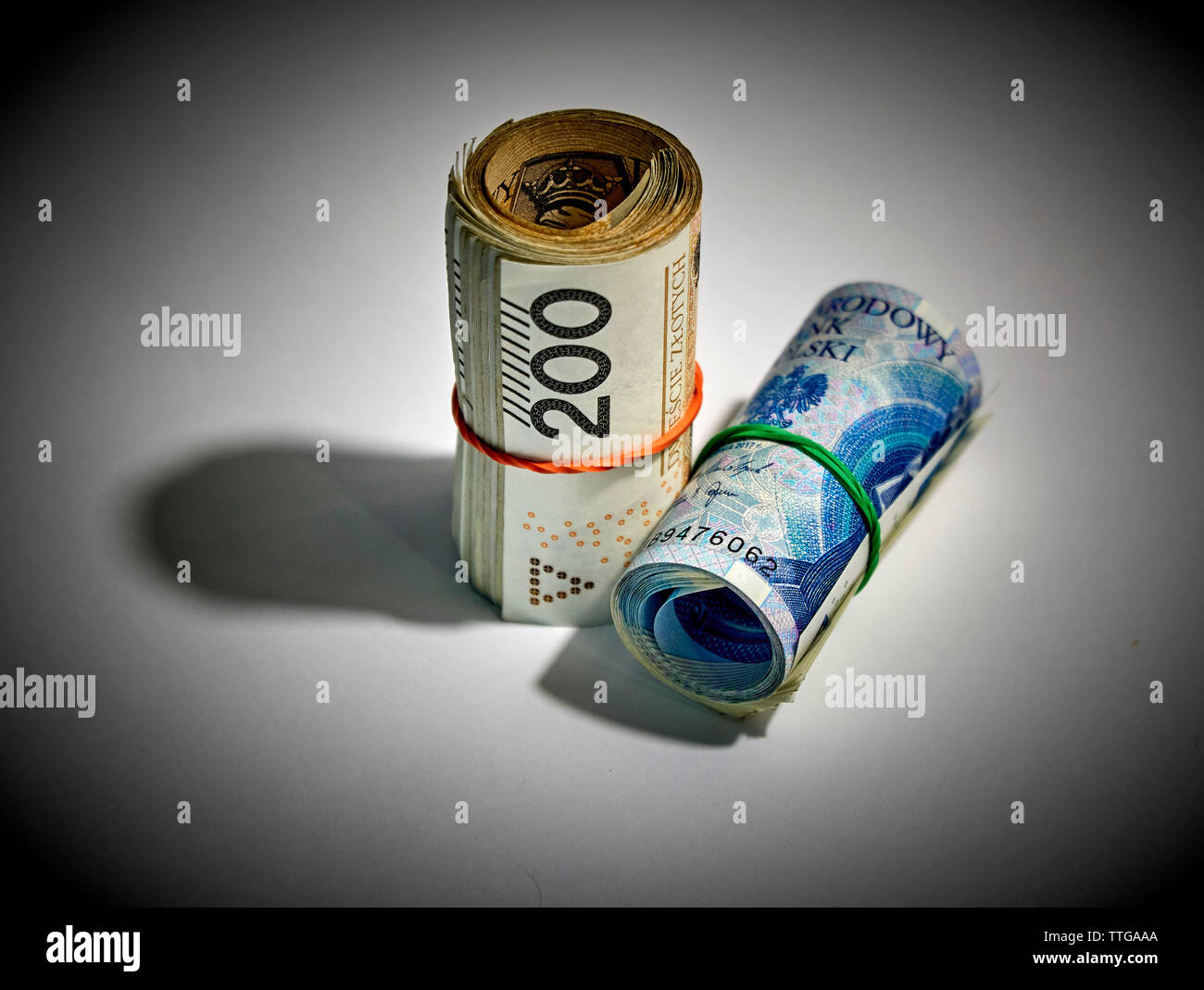 Rolled up polish money (PLN) - two hundred and fifty polish zloty bills ...