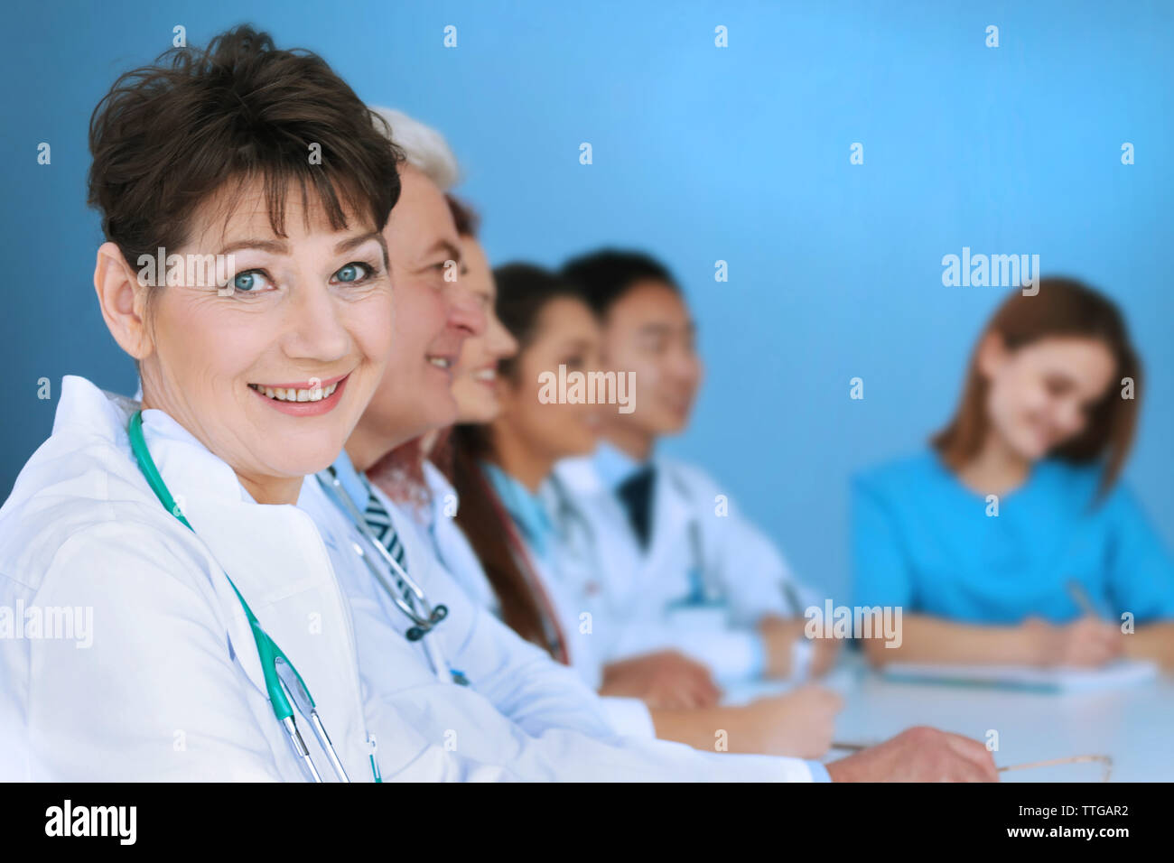 Team of doctors at working place indoors Stock Photo - Alamy