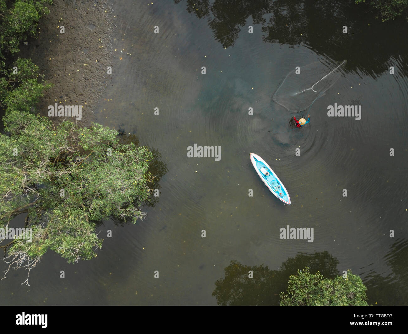 Fisherman with net Stock Photo - Alamy