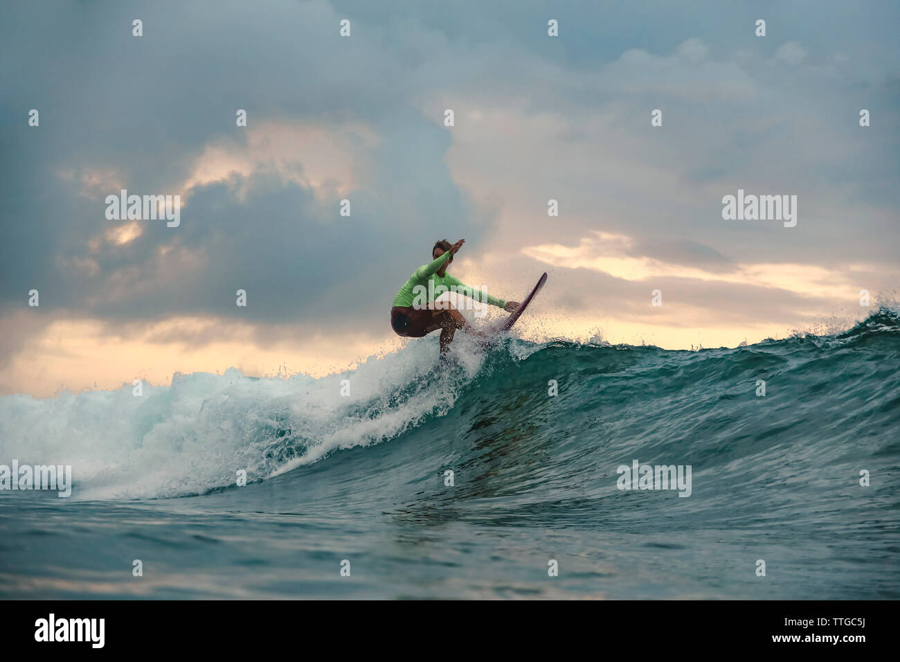 Surfer on a wave Stock Photo - Alamy
