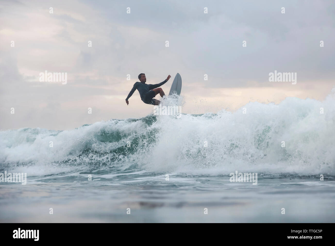 Surfer on a wave Stock Photo - Alamy