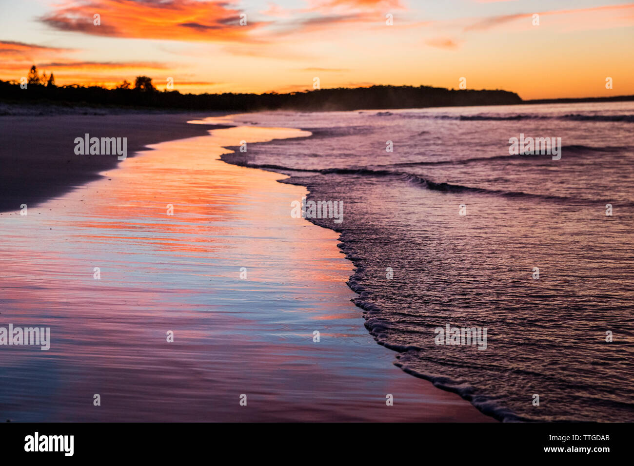 Sunrise at the beach Stock Photo - Alamy
