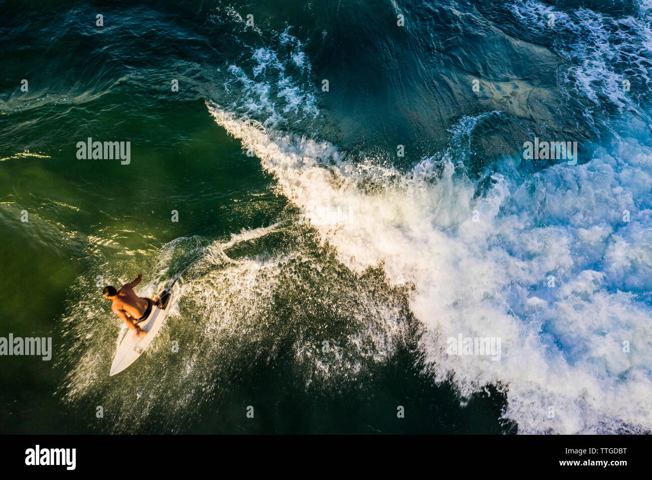 Surfer and wave from above Stock Photo - Alamy