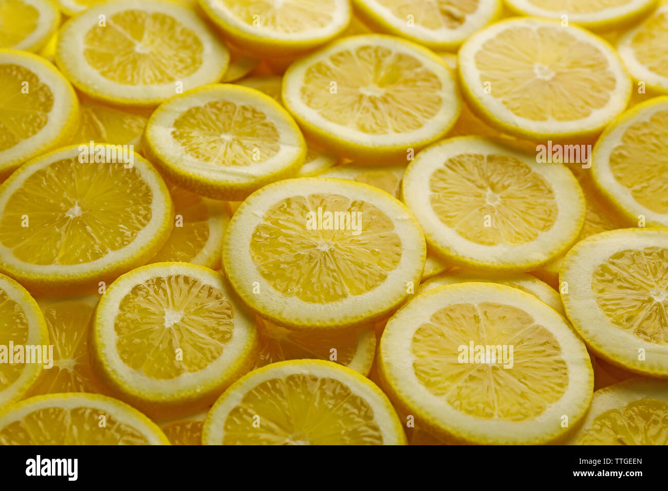 Sliced lemon background Stock Photo - Alamy
