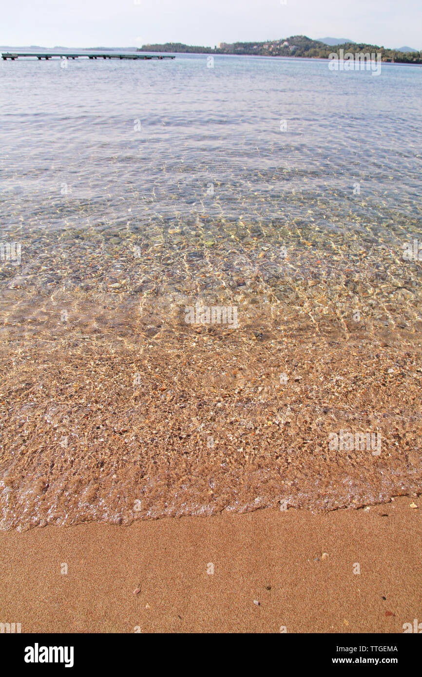 Exotic sandy beach, tropical blue mediterranean sea with waves and sea ...