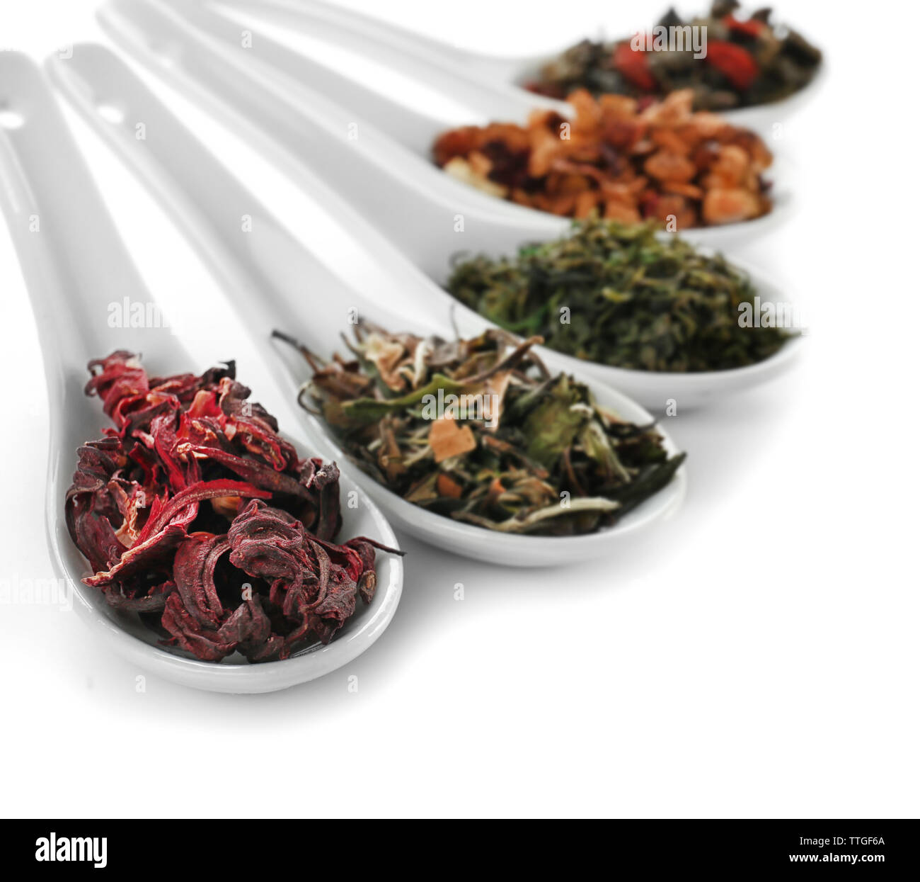 Variety of dry tea in spoons isolated on white Stock Photo - Alamy