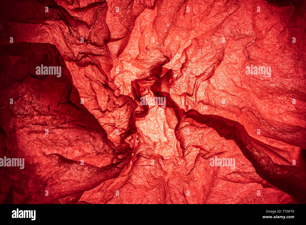 Simulation, with red tissue paper, of blood vessels on a medical image ...