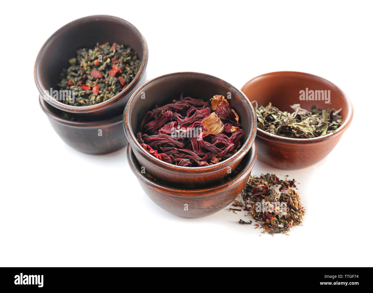 Variety of dry tea in pots isolated on white Stock Photo - Alamy