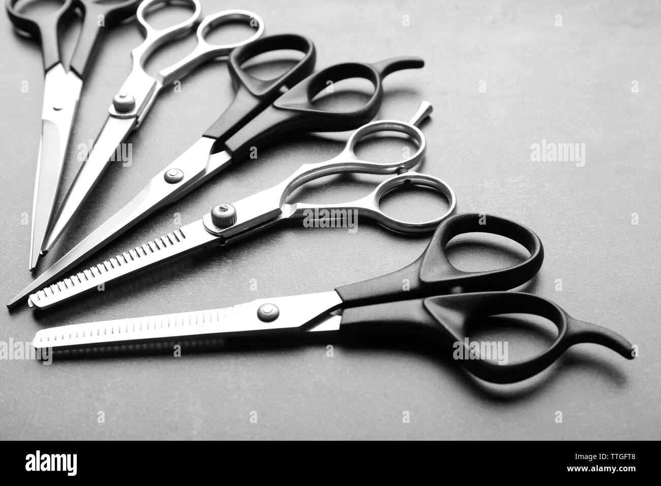 Professional metal scissors on a dark grey surface, close up Stock ...
