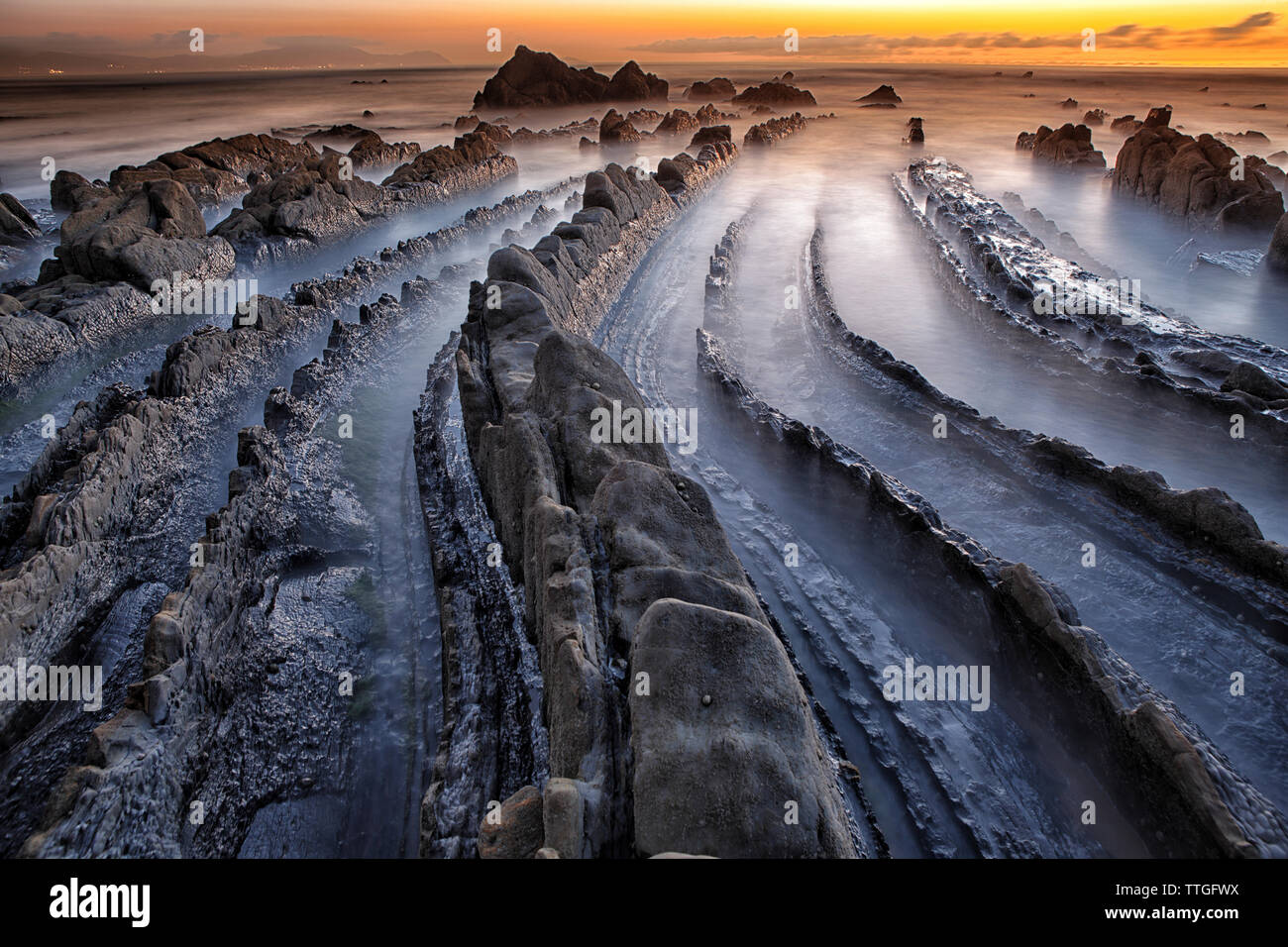 Barrika beach in a cloudy night, Basque country, Spain Stock Photo - Alamy