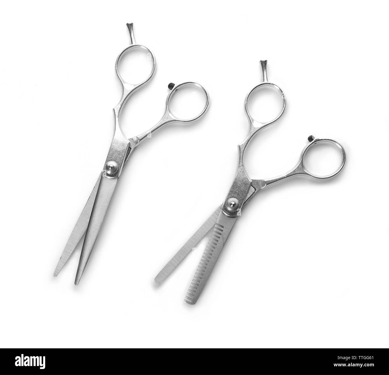 Two professional metal scissors in open positions isolated on white ...