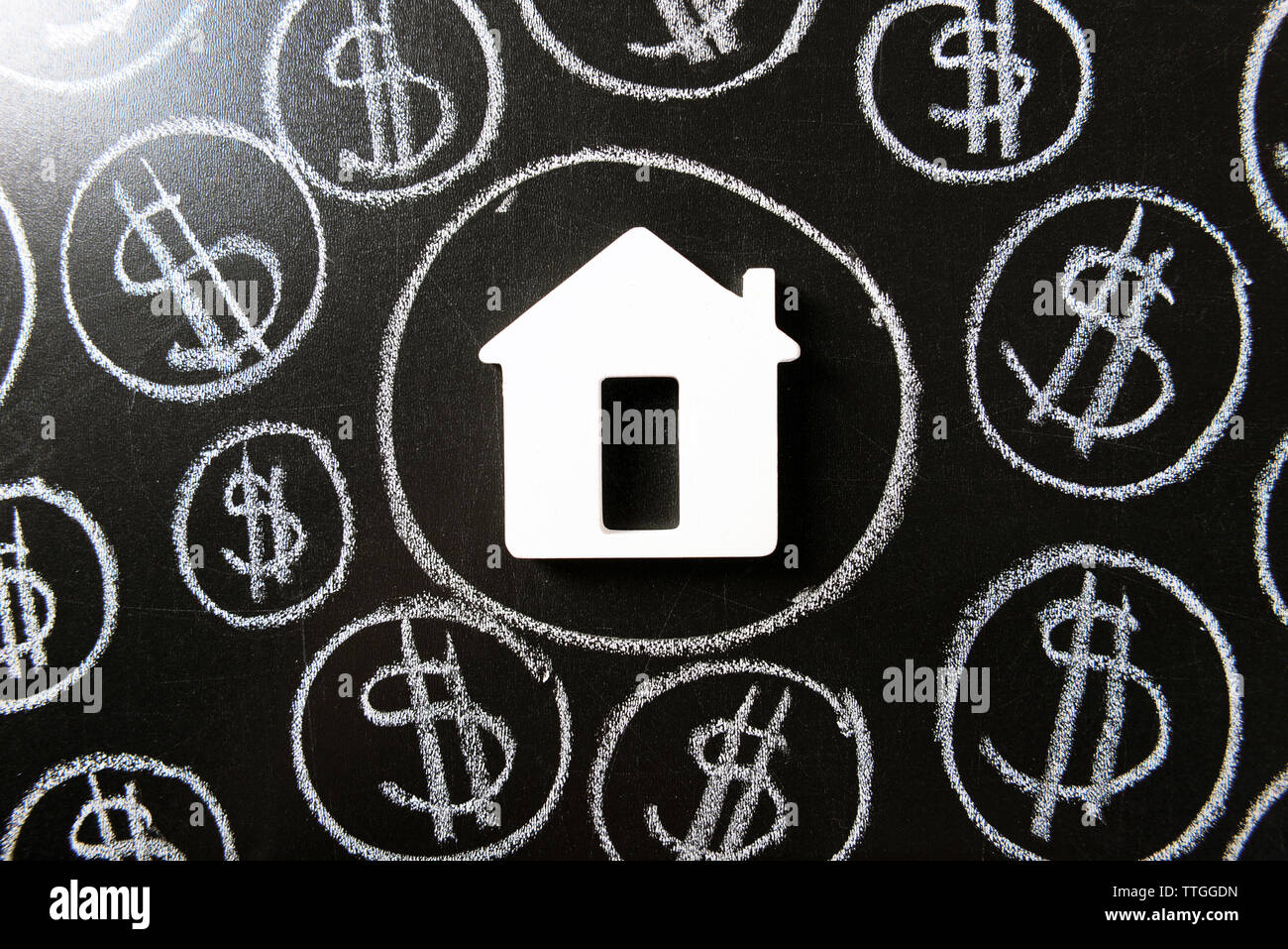 House figure and painted dollar symbols on chalkboard,closeup Stock ...