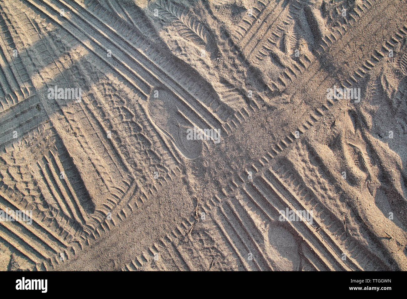 Tracks in sand. Part of prints and tracks of tire, foot, feet, sun sea ...
