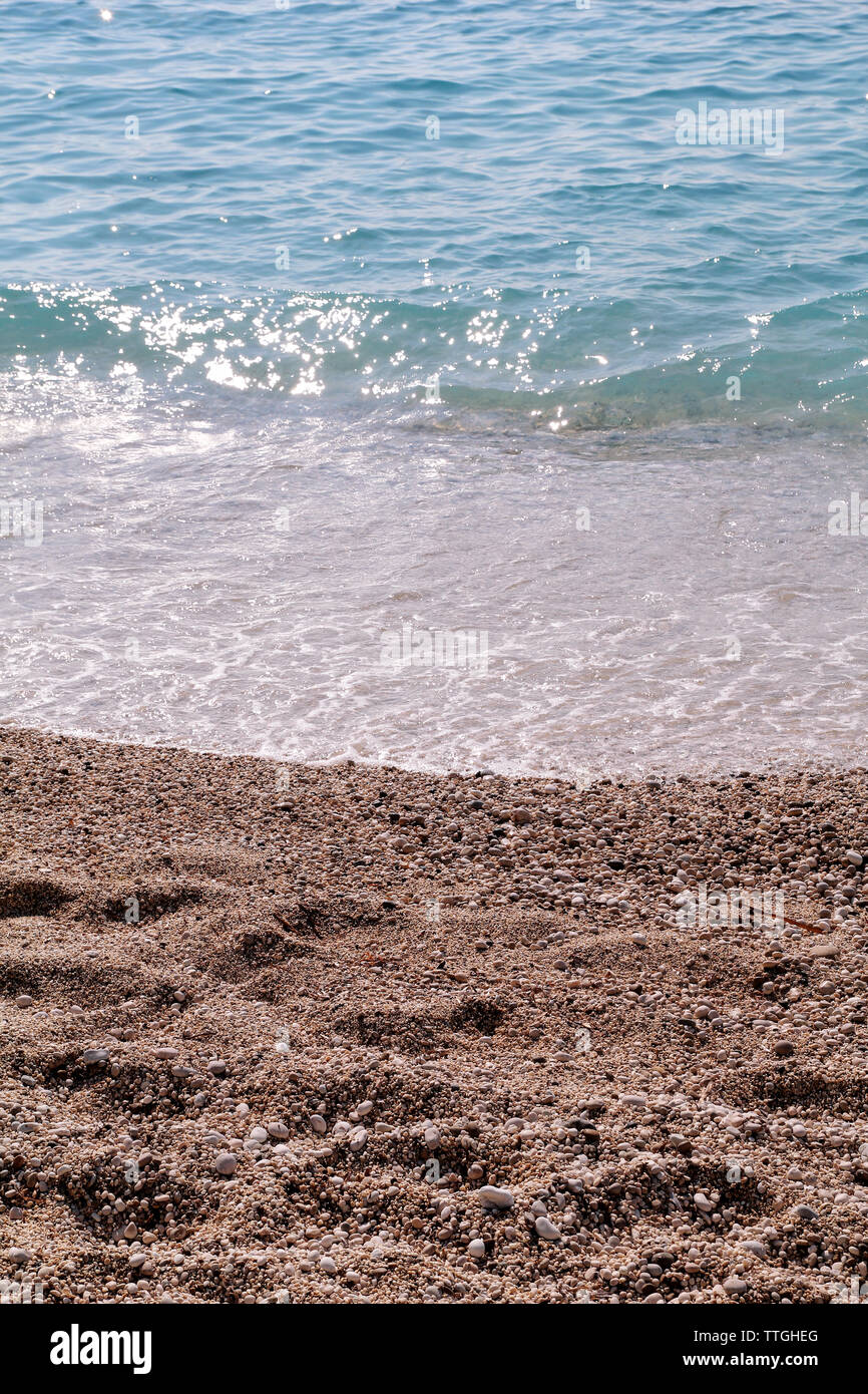Exotic sandy beach, tropical blue mediterranean sea with waves and sea ...