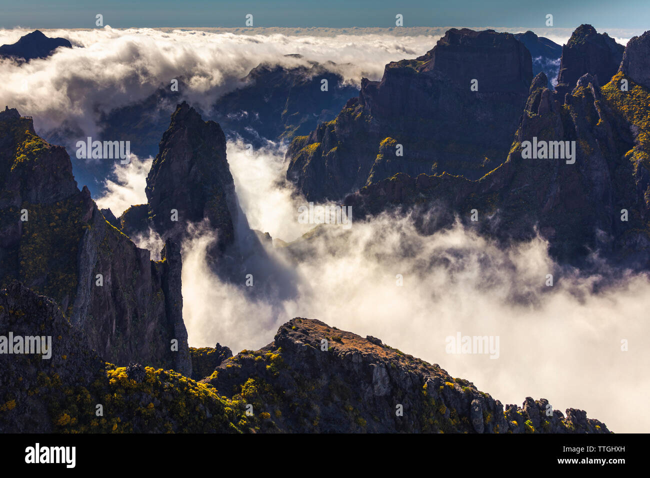 Sharp point rock among the clouds Stock Photo - Alamy