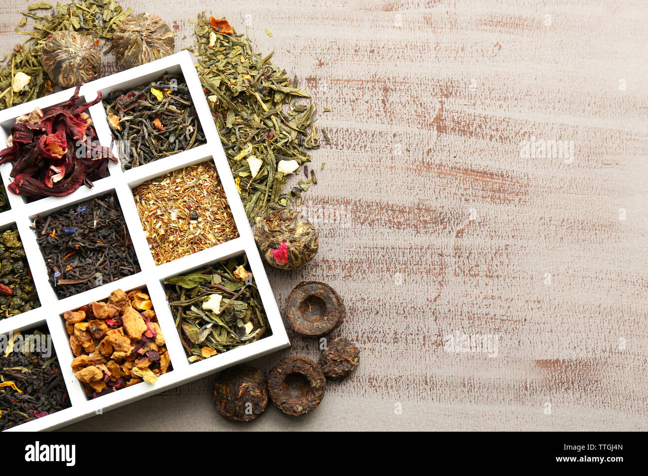 Variety of dry tea in box on mat background, closeup Stock Photo - Alamy