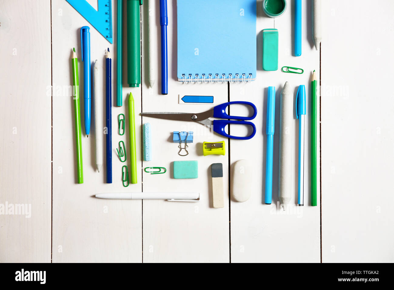 Flat lay of stationery on white wooden table background Stock Photo - Alamy
