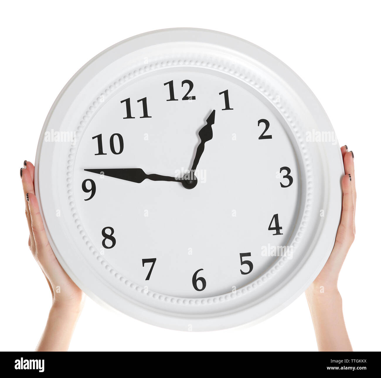 Woman hands holding big round clock, isolated on white Stock Photo - Alamy