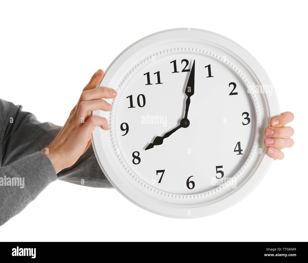 Man hands holding big round clock, isolated on white Stock Photo - Alamy