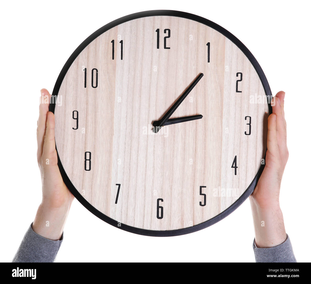 Man hands holding big round clock, isolated on white Stock Photo - Alamy