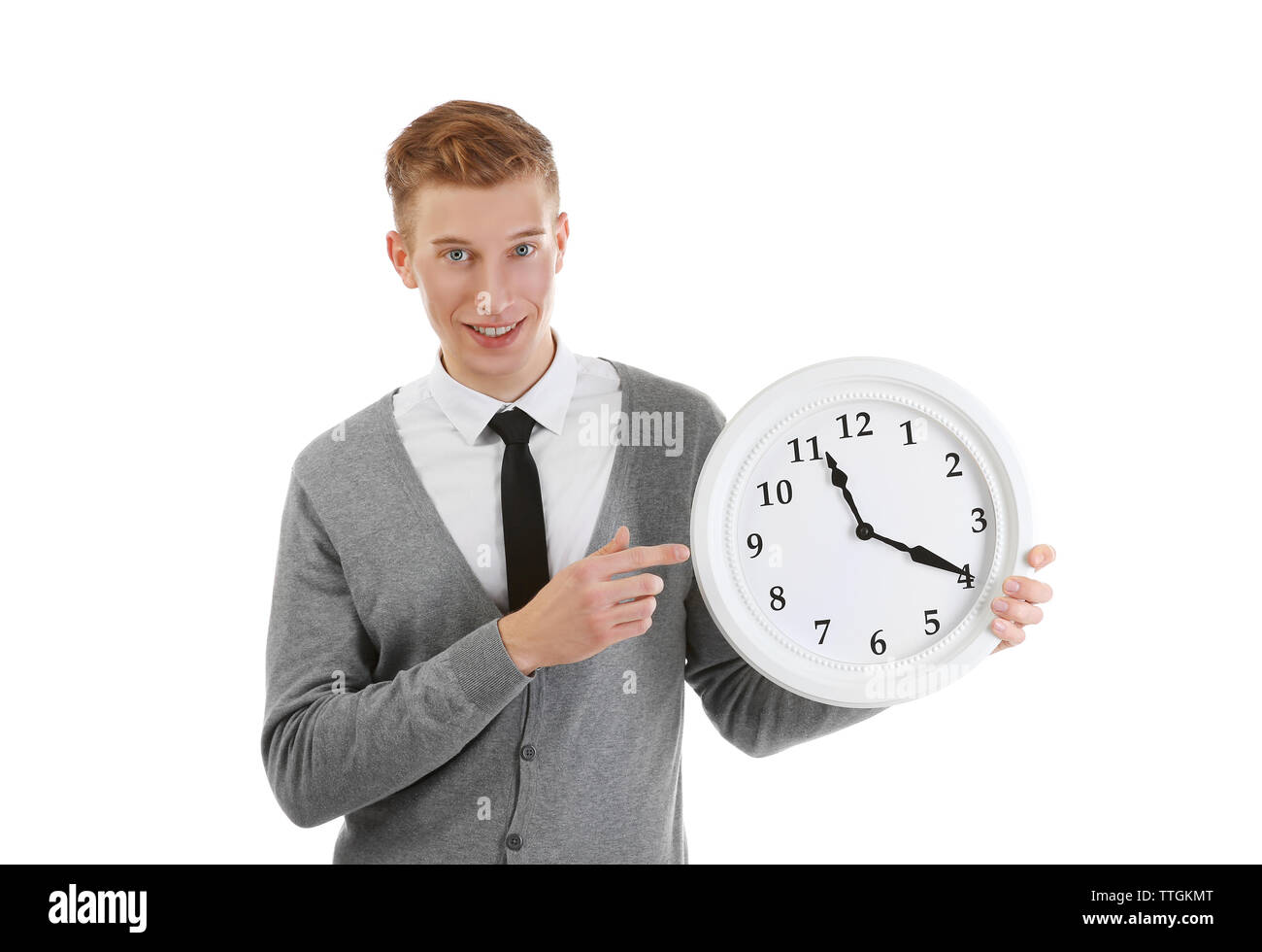 Handsome young man holding clock, isolated on white Stock Photo - Alamy