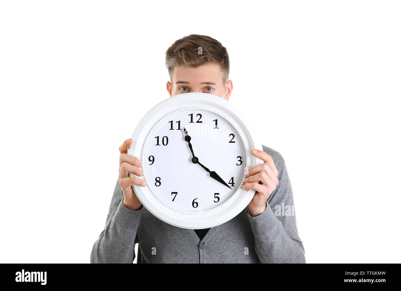 Young handsome man holding clock, isolated on white Stock Photo - Alamy