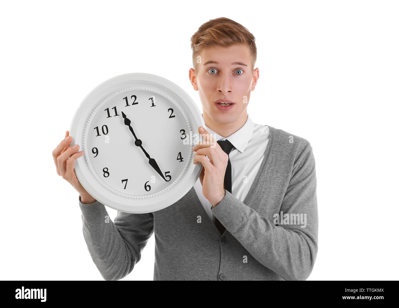 Handsome young man holding clock, isolated on white Stock Photo - Alamy