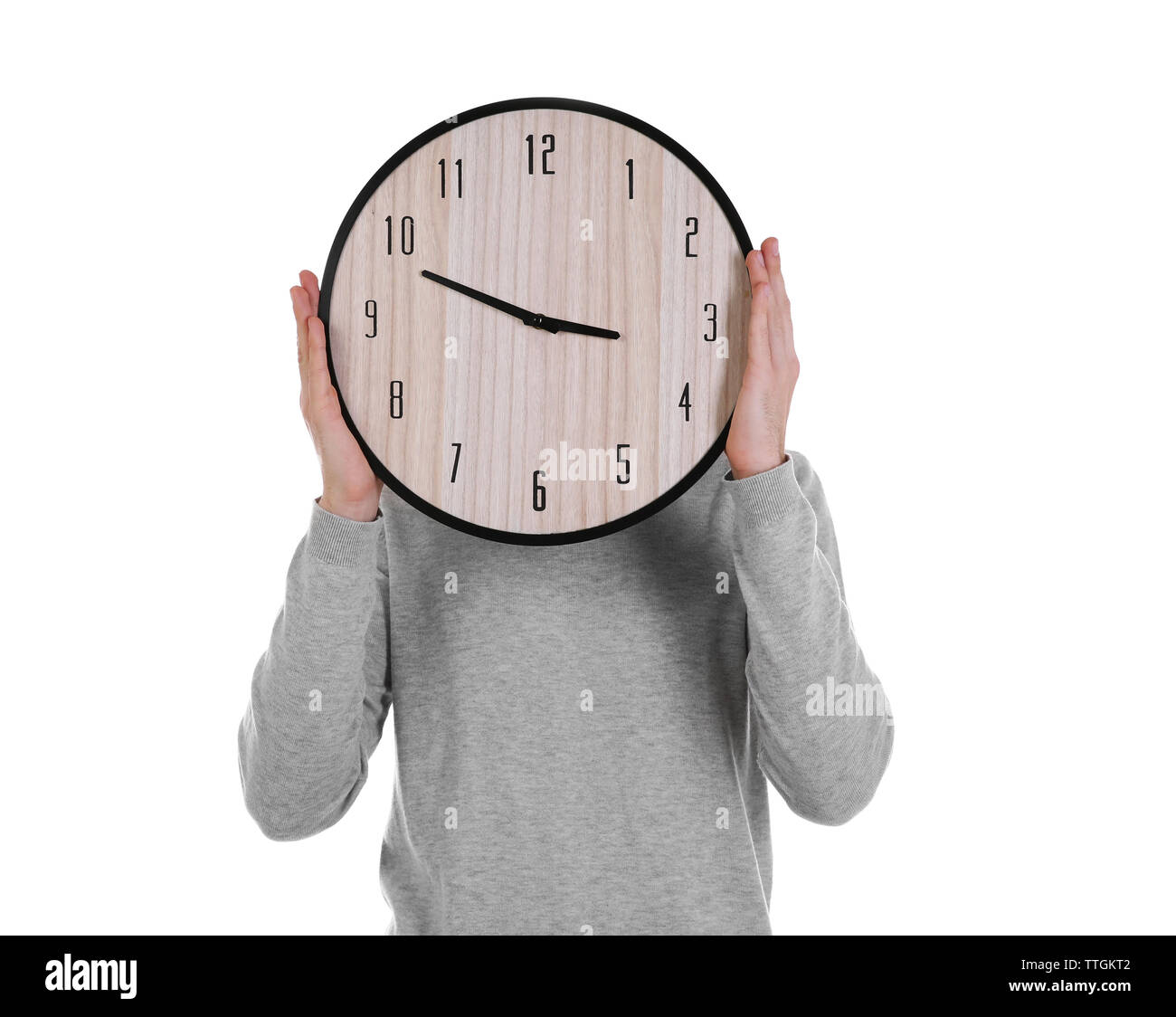 Young man holding clock, isolated on white Stock Photo - Alamy