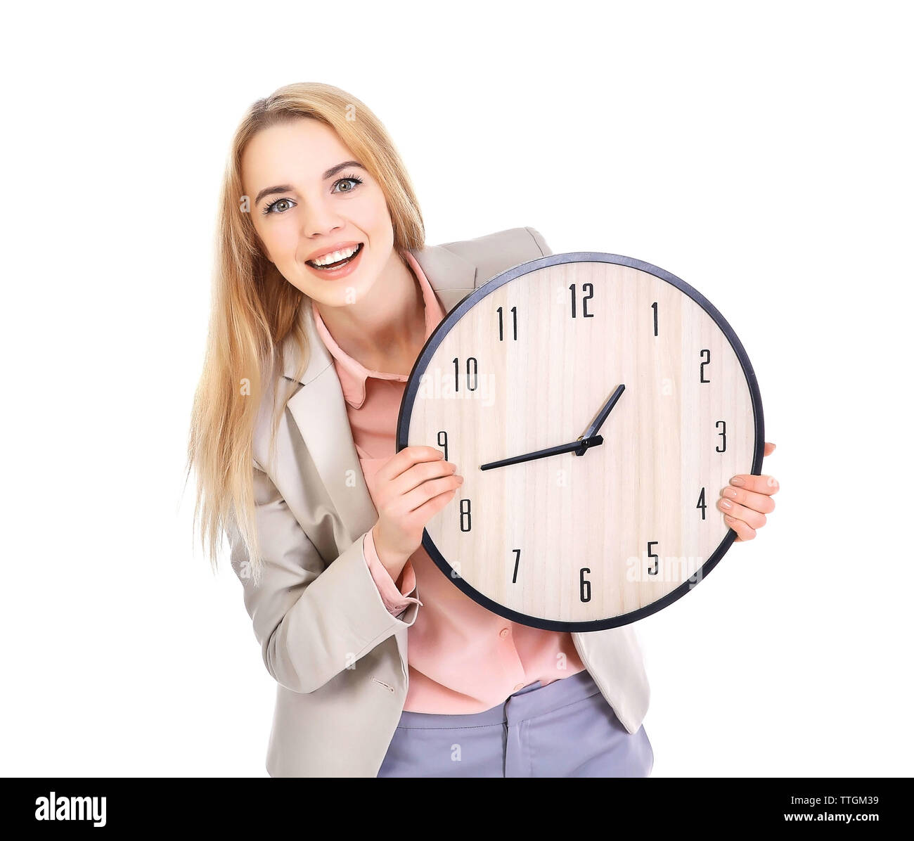 Beautiful young girl holding clock, isolated on white Stock Photo - Alamy