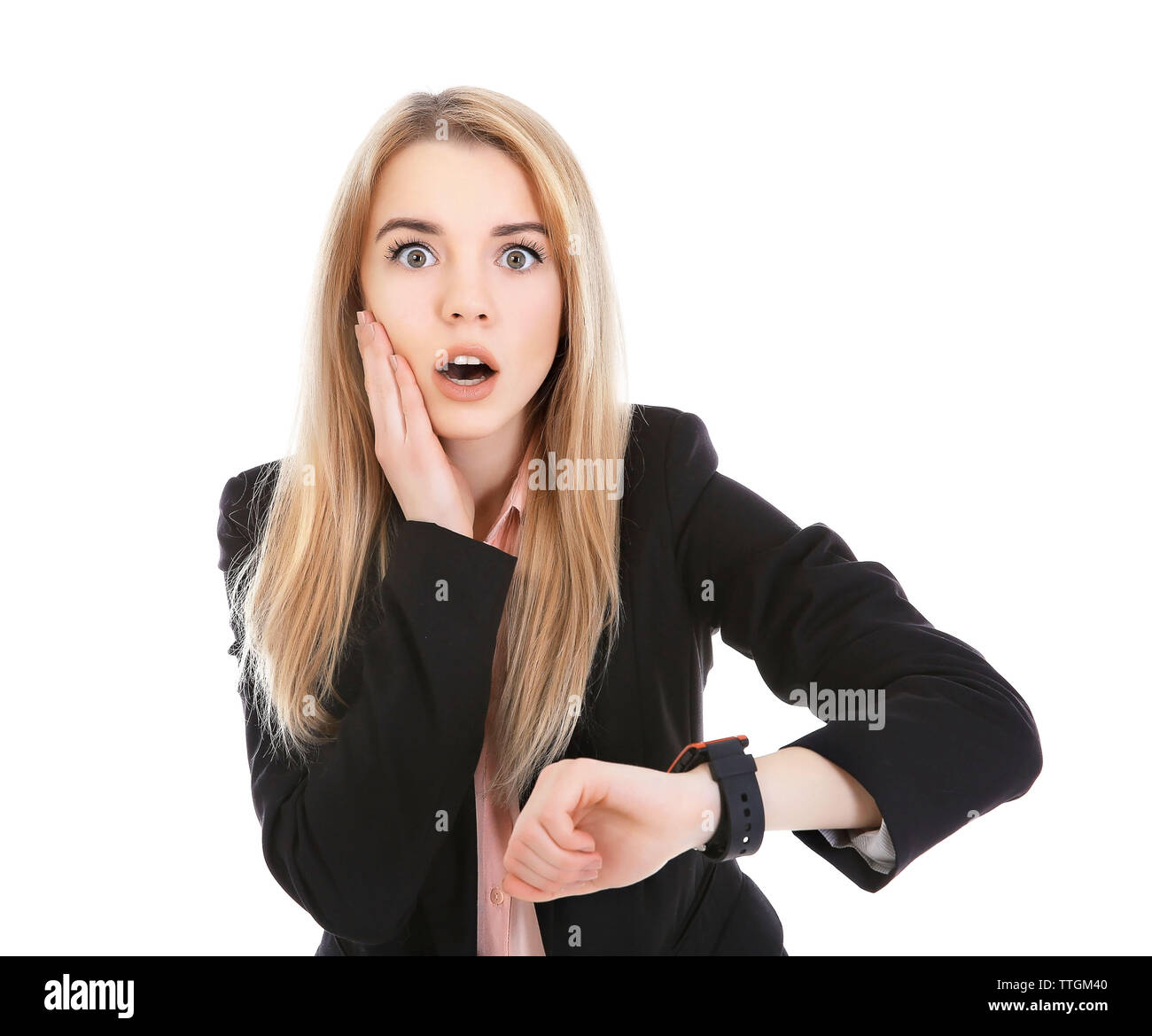 Young beautiful girl looking at her watch, isolated on white Stock ...